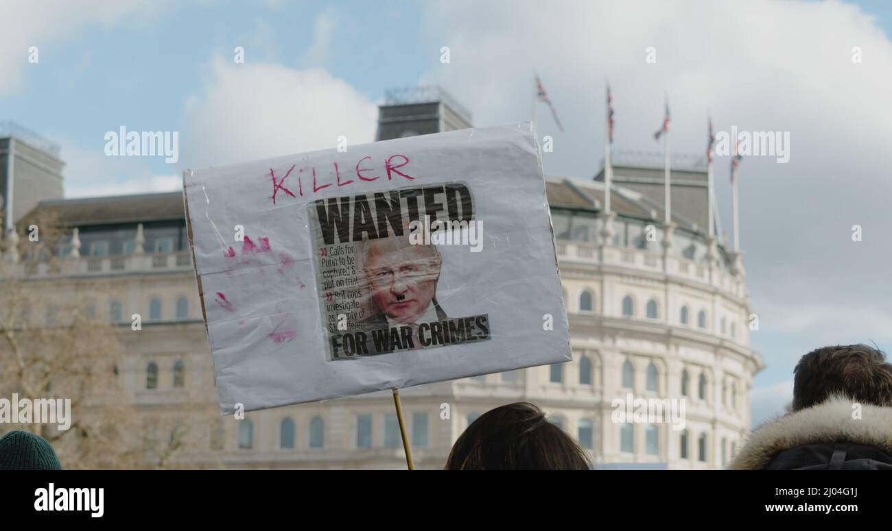London, UK - 03 06 2022: A protester at Trafalgar Square holding a sign ...