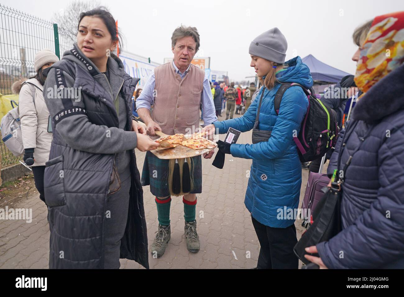 David Fox-Pitt, 57, from Loch Tay in Perthshire, hands out pizza to ...