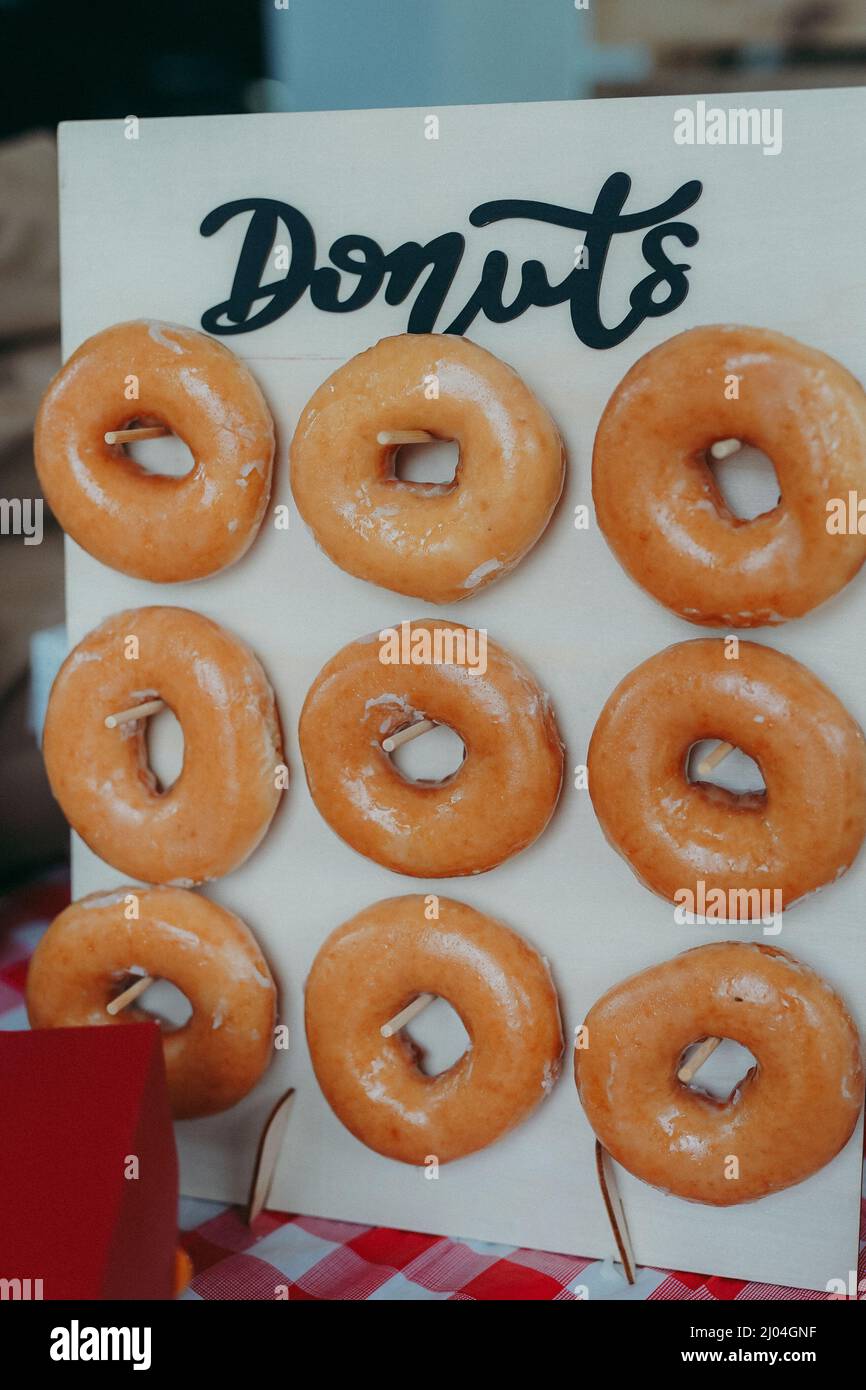 Donuts hanging hi-res stock photography and images - Alamy