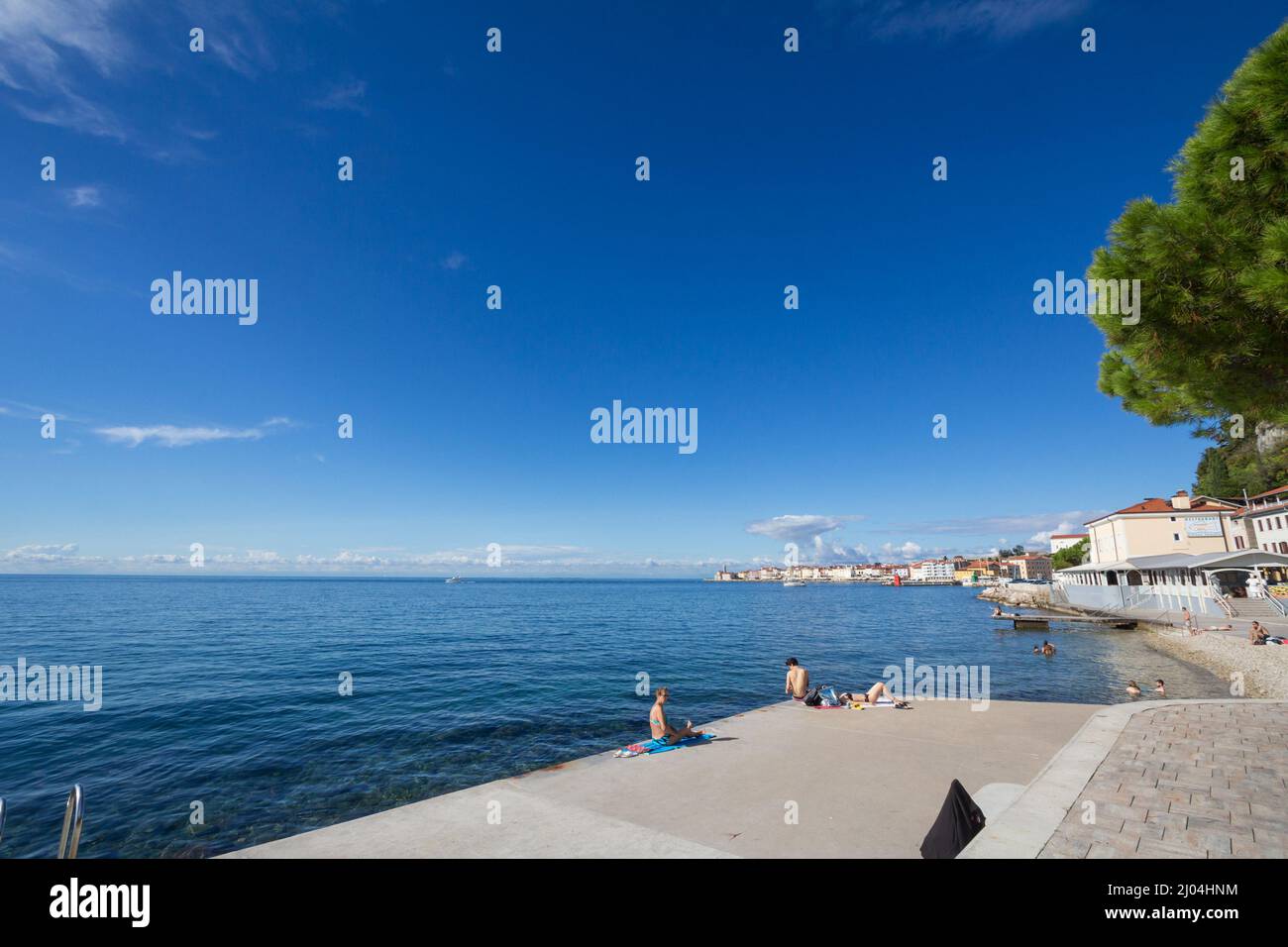 Picture of the adriatic sea taken in Piran, slovenia with people on a ...