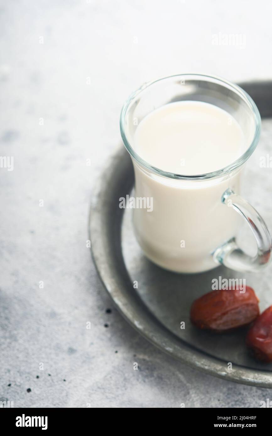 Ramadan Kareem food and drinks. Plate of dates, glass of milk and date ...