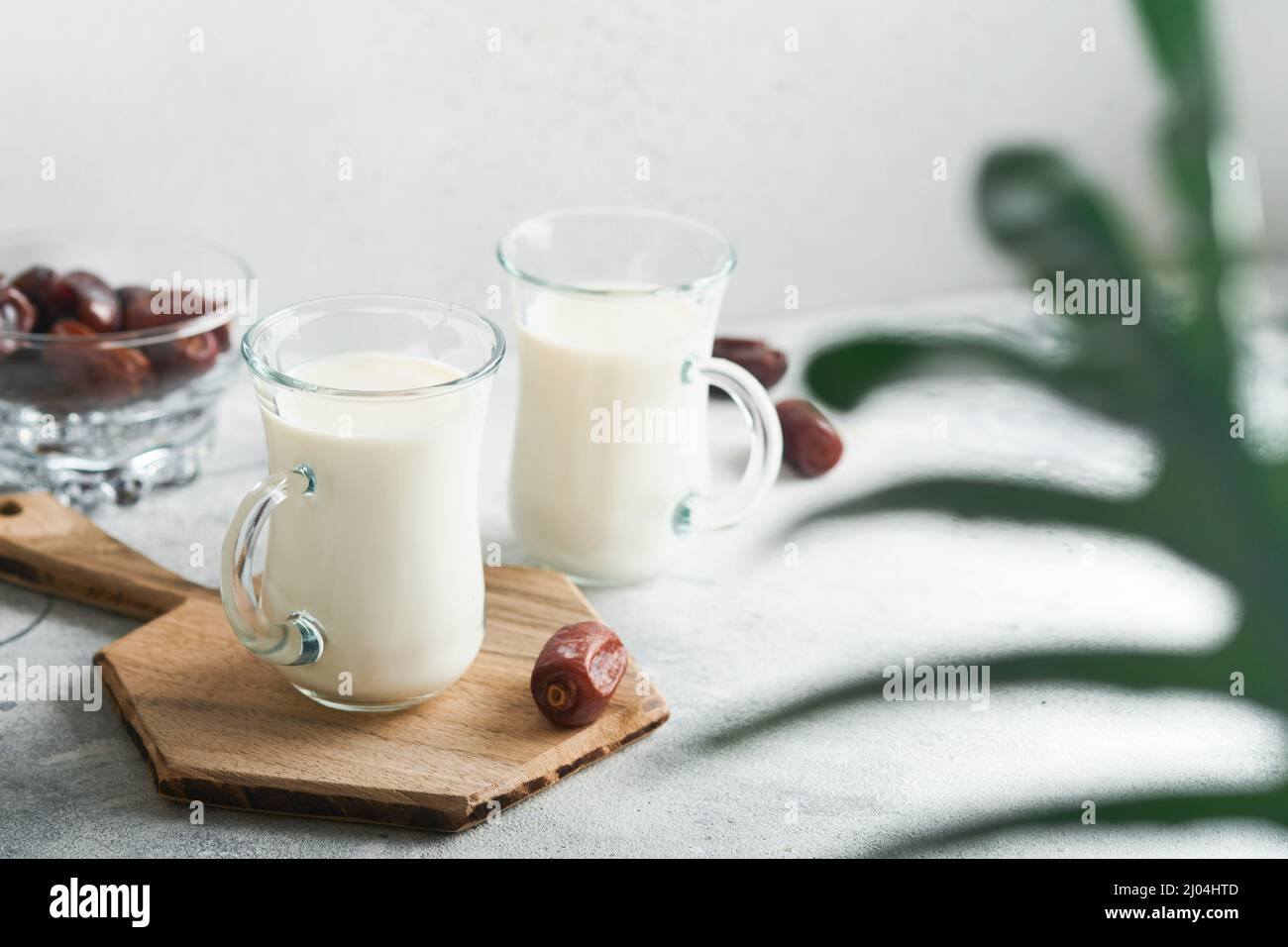 Ramadan Kareem food and drinks. Plate of dates, glass of milk and date ...