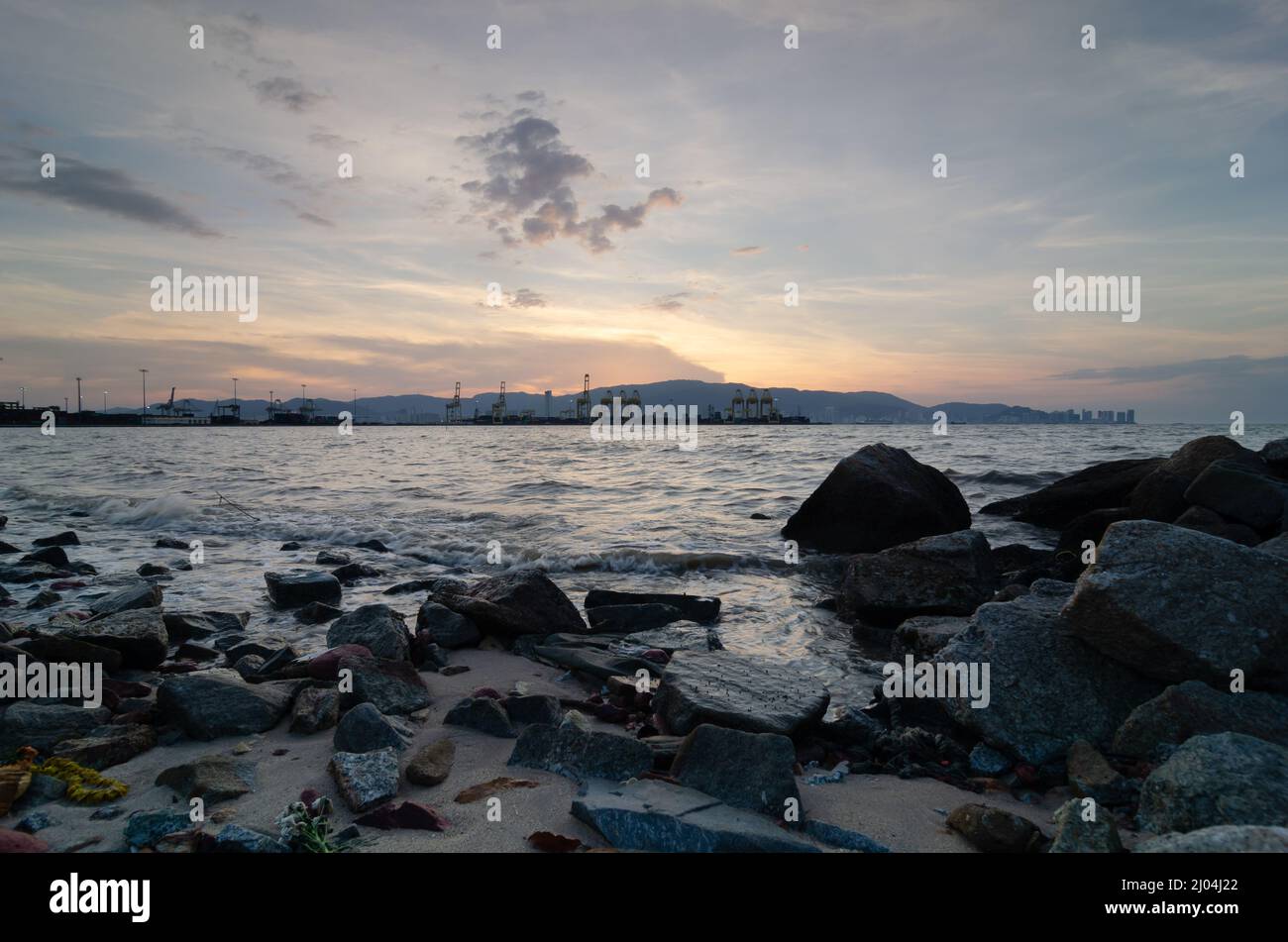 Low angle rock at sea coastal during sunset Stock Photo - Alamy