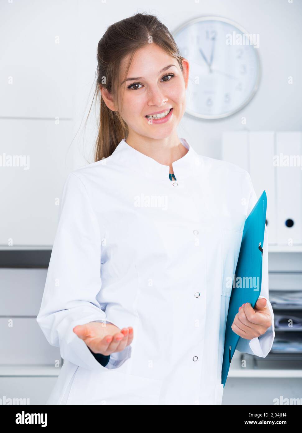 Female doctor making welcome gesture, politely inviting patient in ...