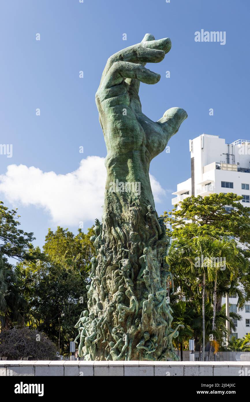 The Holocaust Memorial in Miami Beach features a reflection pool with a ...