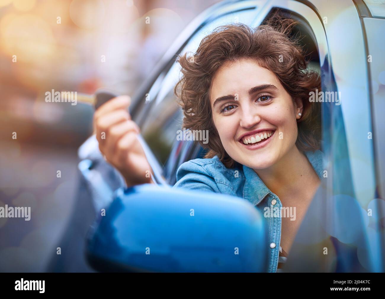 Life is a journey and you hold the keys. Shot of a happy young woman ...