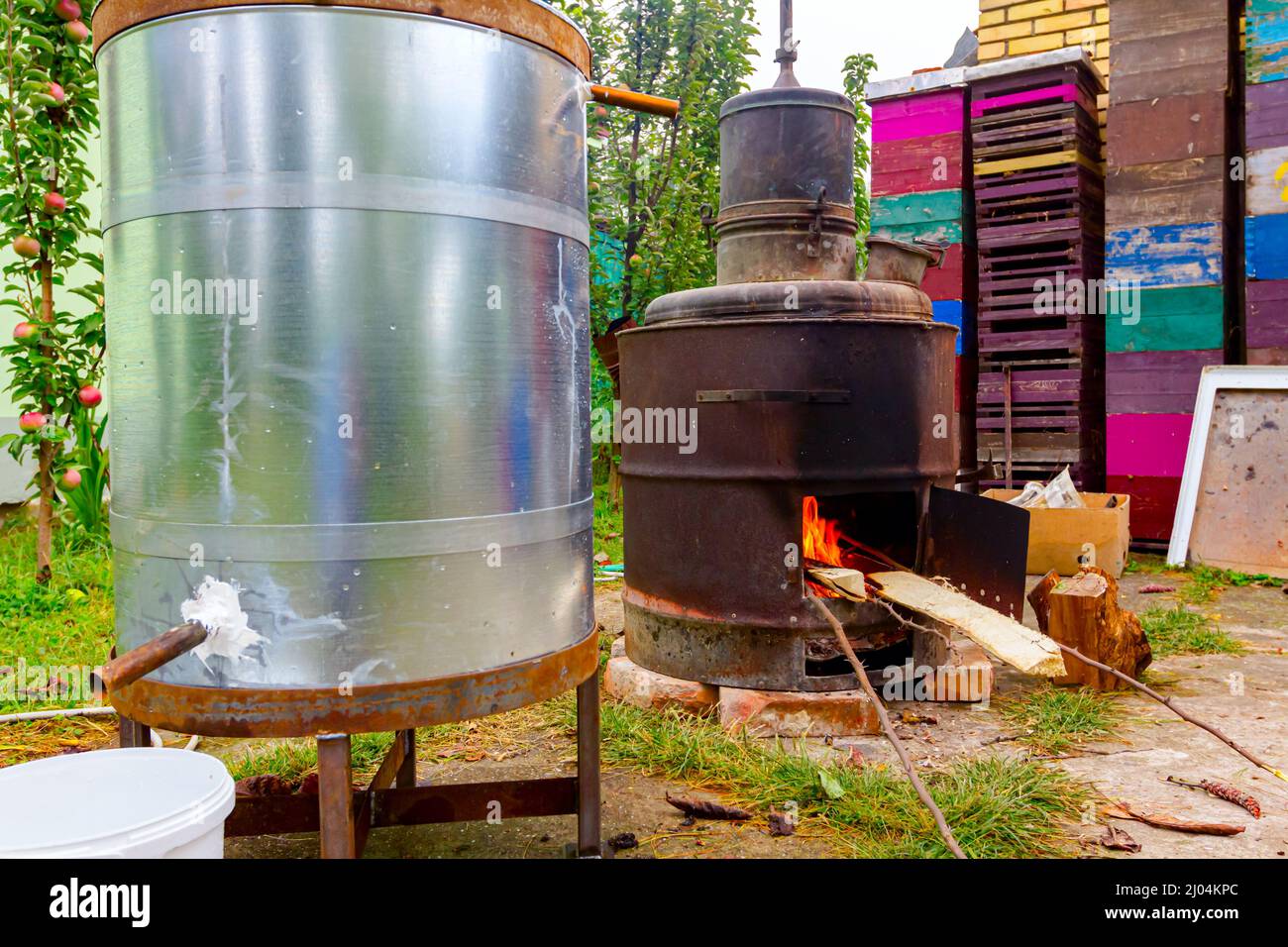 Domestic production with homemade distillery made of copper, making ...