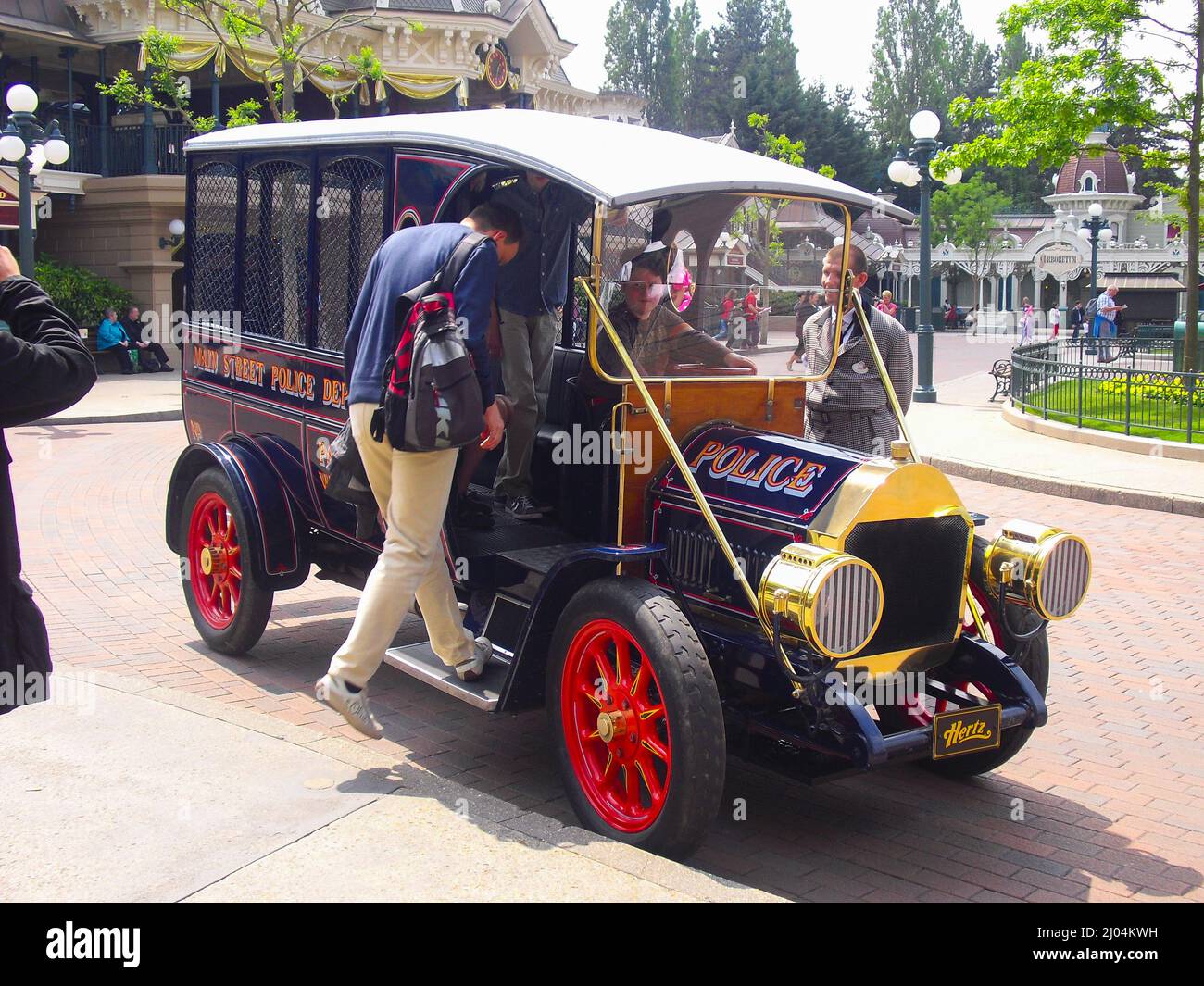 Person getting on a vintage tour car in Disneyland Paris Stock Photo ...
