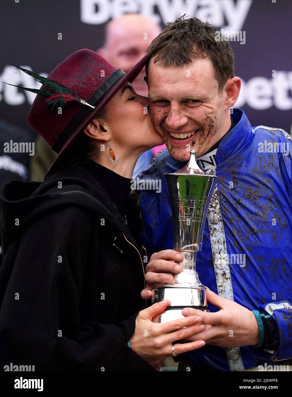 Jockey Paul Townend receives his trophy and a kiss from Anna Paoletti ...