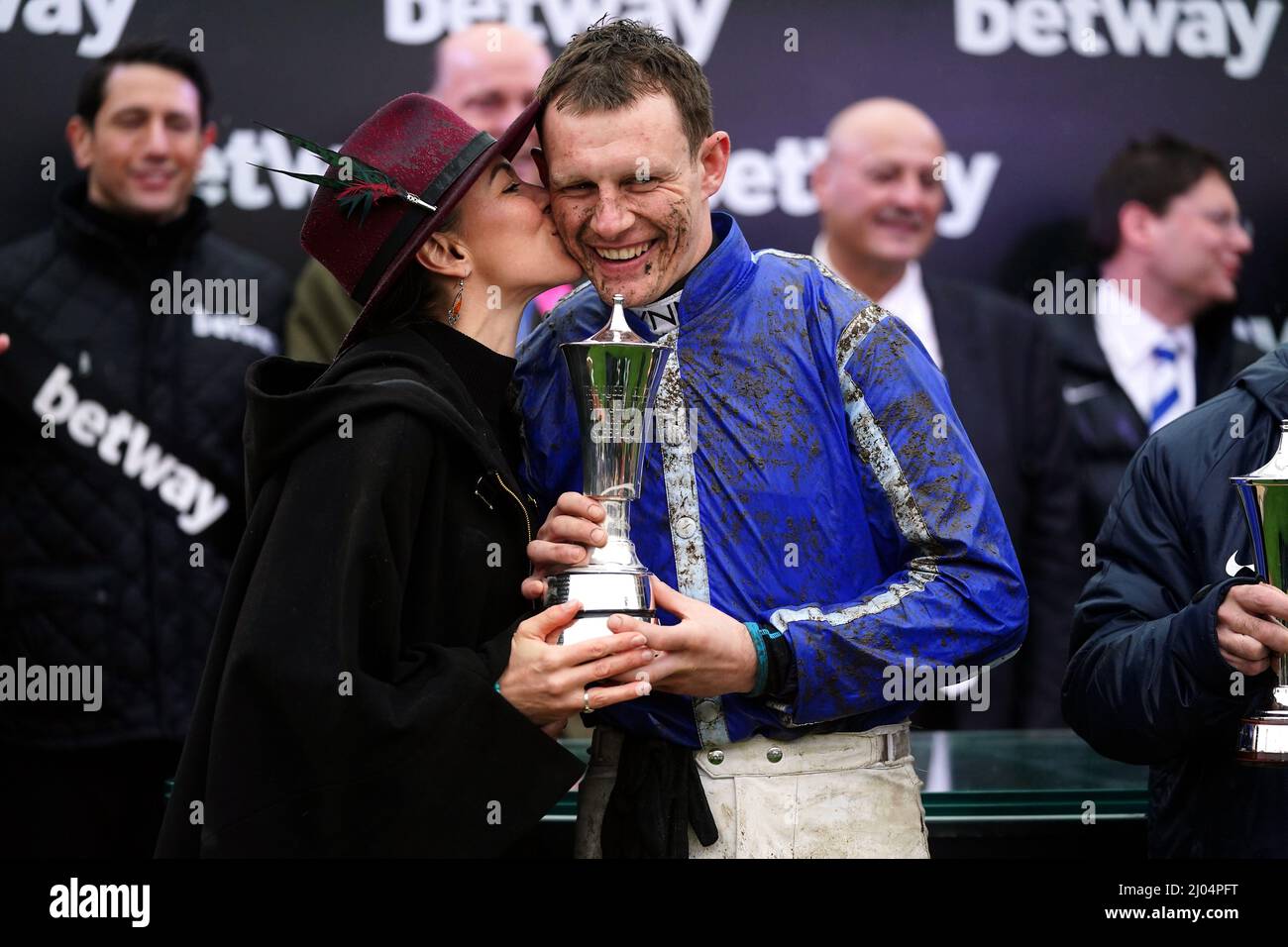Jockey Paul Townend receives his trophy and a kiss from Anna Paoletti ...