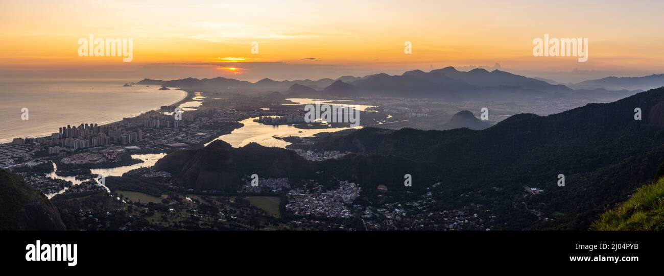 Beautiful sunset view to city, mountains and ocean Stock Photo - Alamy