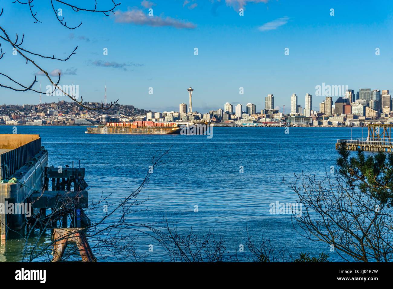 A shipping barge and the Seattle skyline in Washington State Stock ...