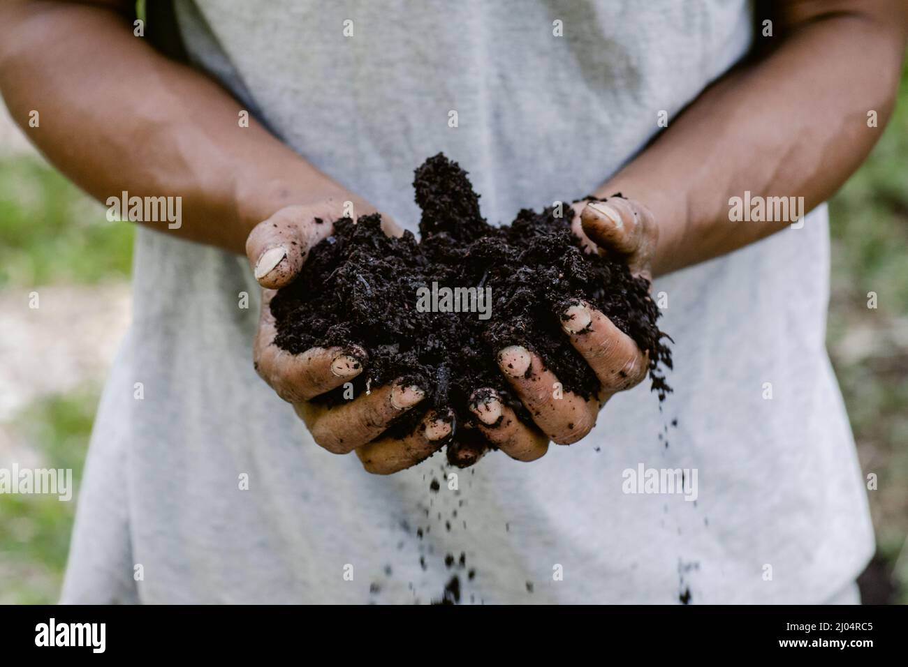 African hands soil hi-res stock photography and images - Alamy