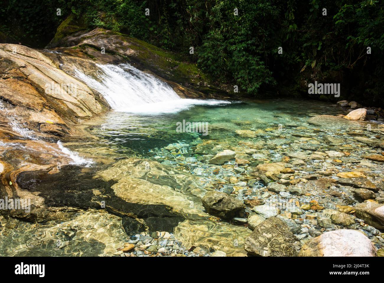 Beautiful view to green atlantic rainforest waterfall with blue water ...