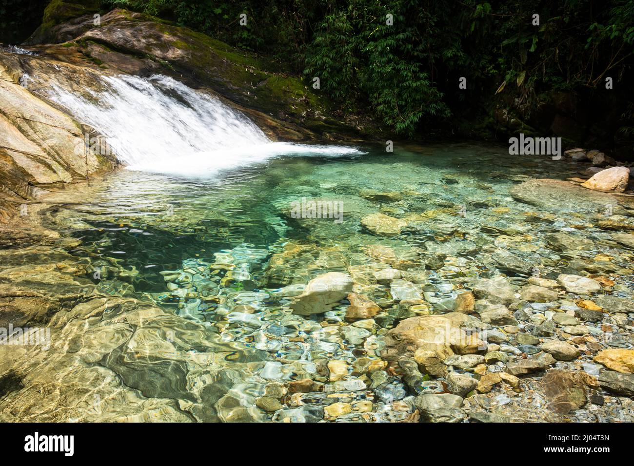 Beautiful view to green atlantic rainforest waterfall with blue water ...