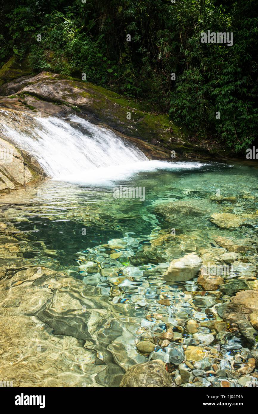 Beautiful view to green atlantic rainforest waterfall with blue water ...