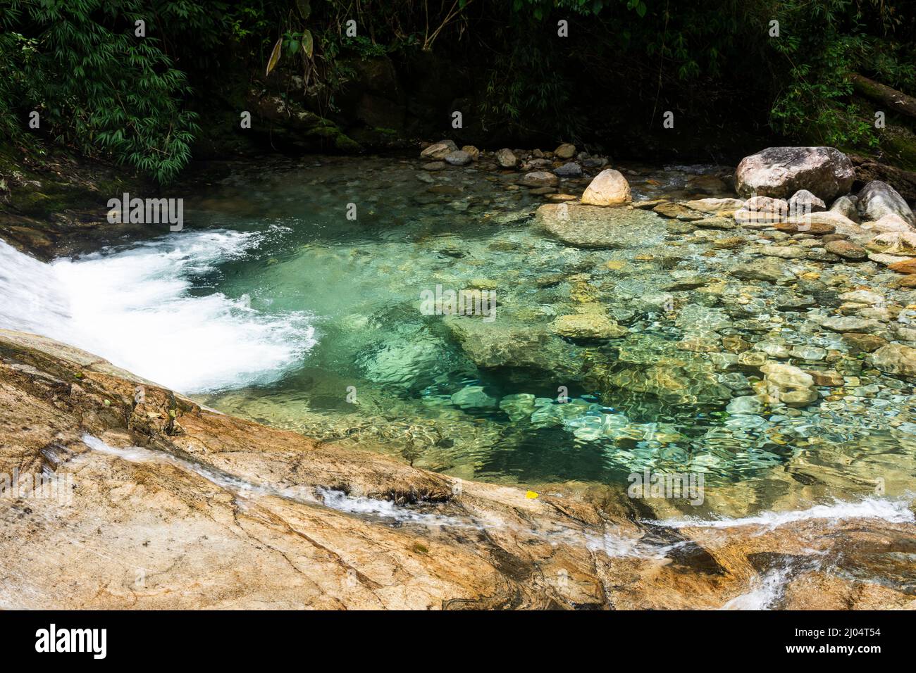 Beautiful view to green atlantic rainforest waterfall with blue water ...