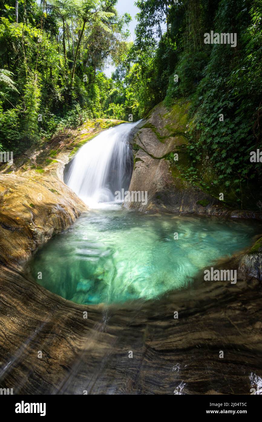 Beautiful view to green atlantic rainforest waterfall with blue water ...