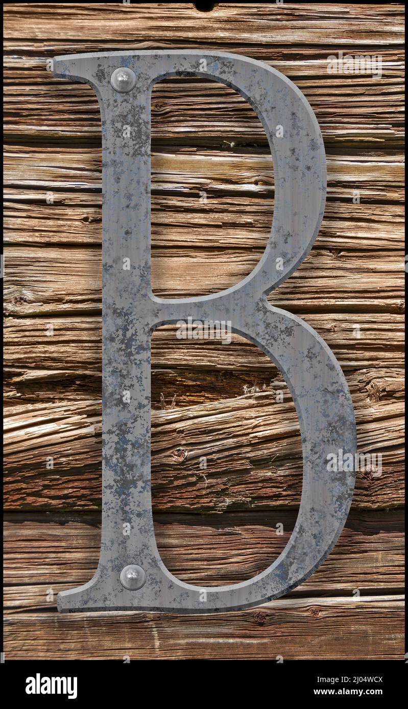 Iron letter B on old wood Stock Photo - Alamy