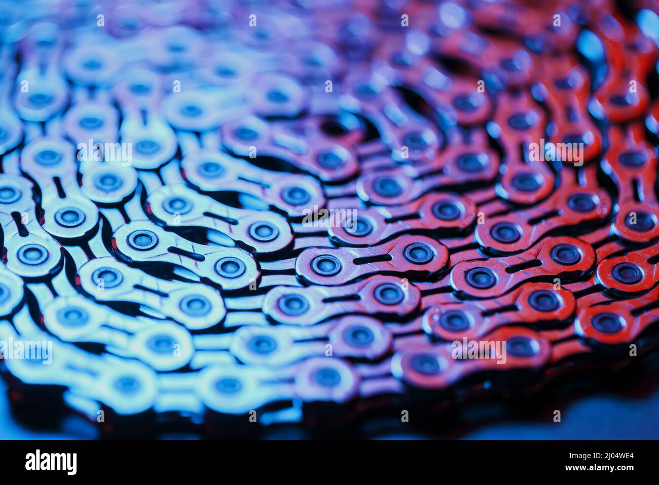 Silver chain of a road bike on a dark textured background with free ...