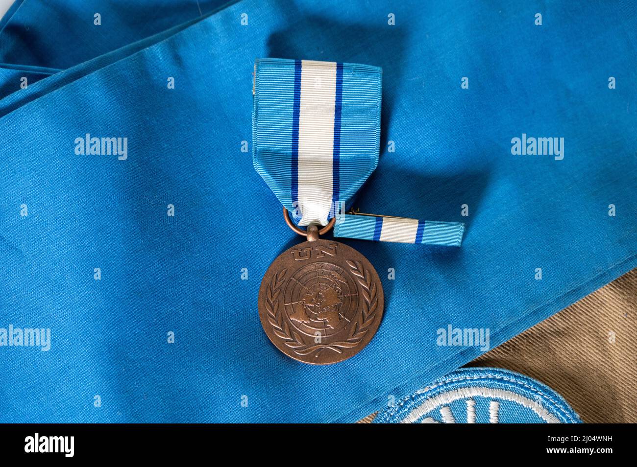 Overhead shot of the front of a United Nations Peacekeeper's medal and ...