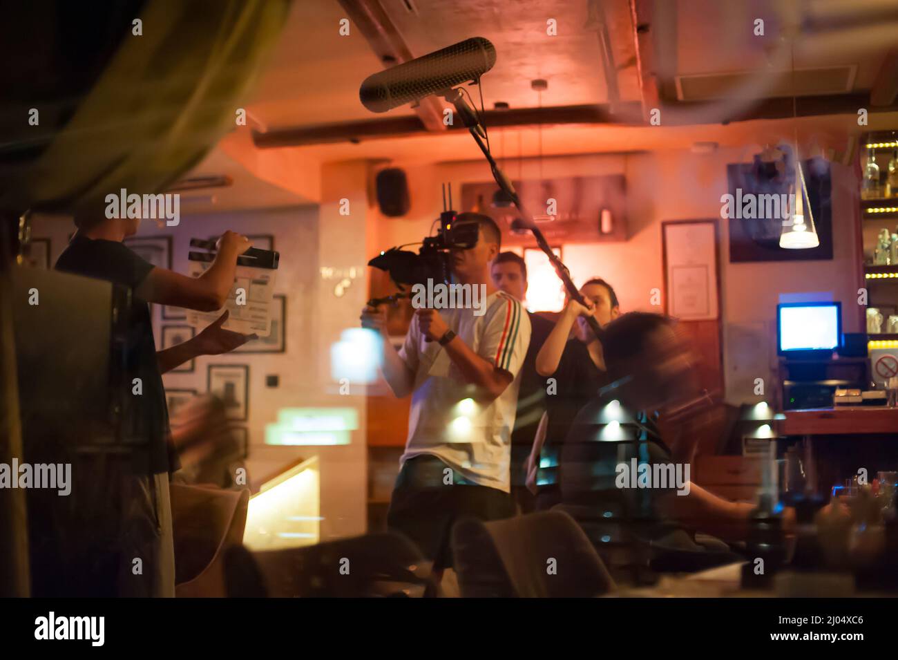 Behind the scenes. Film crew team, cameraman and sound technician ...