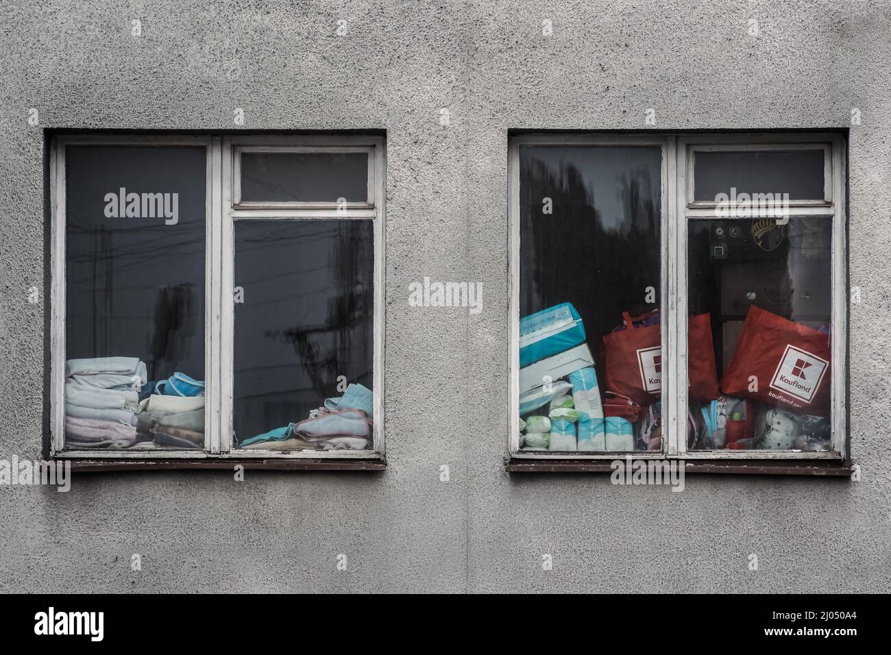 Local volunteers sort packages of child diapers at a condominium - NOWA ...
