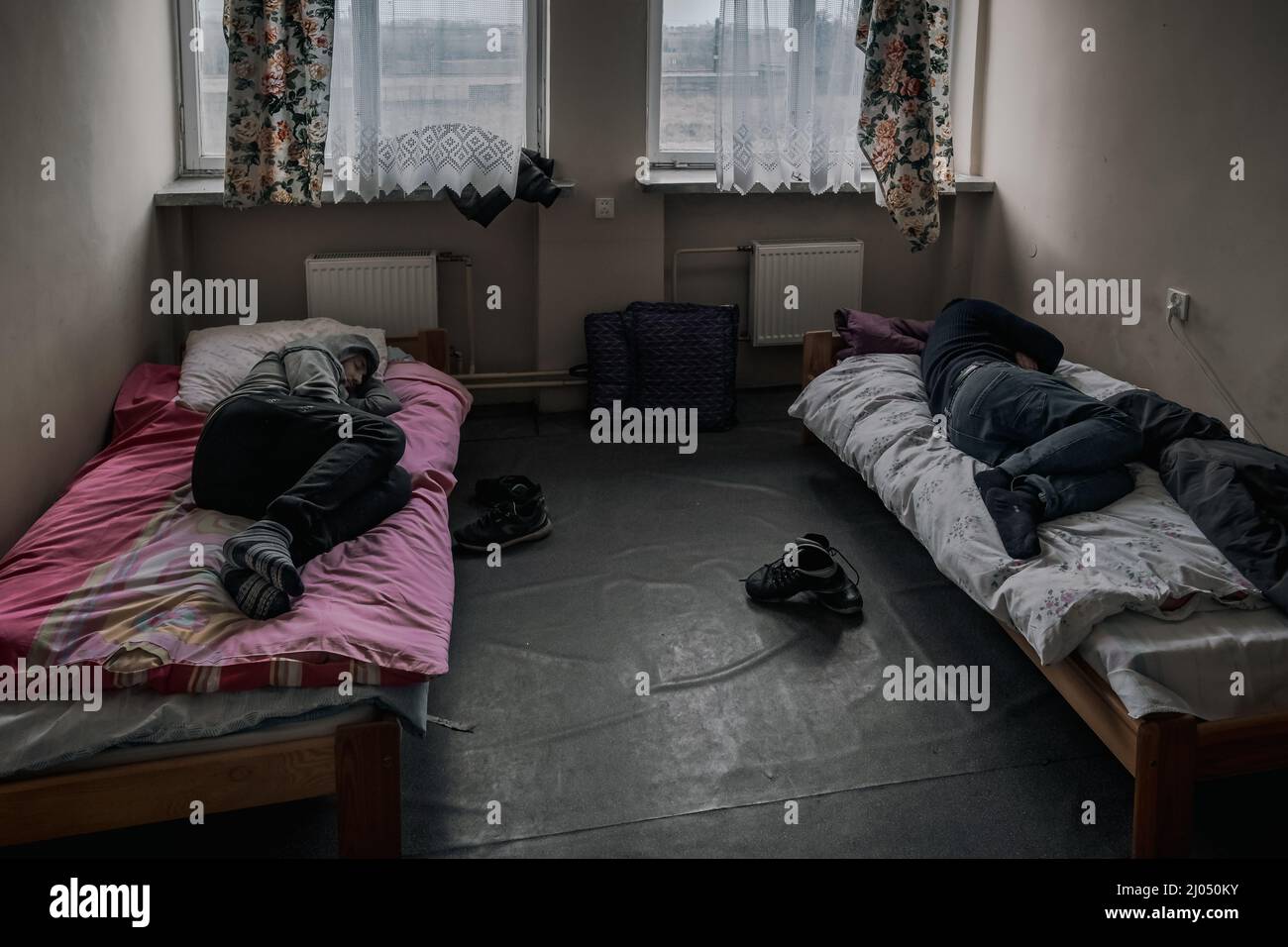 Refugees sleep border hi-res stock photography and images - Alamy