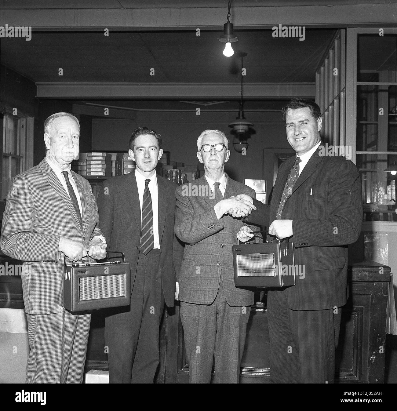 1960s, historical, two eldery gentlemen, long serving company employees ...