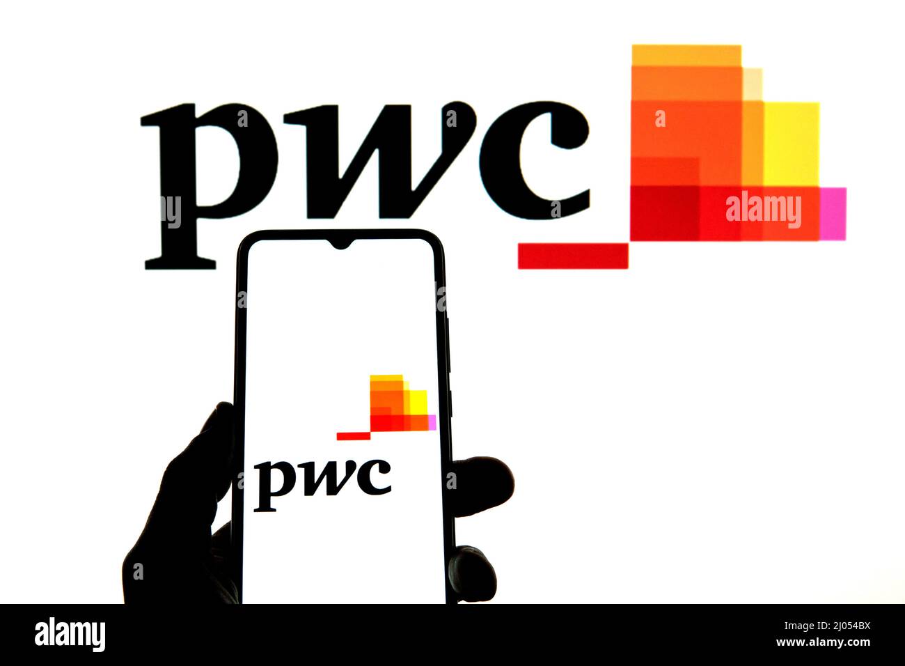 In this photo illustration a PwC logo seen displayed on a smartphone ...