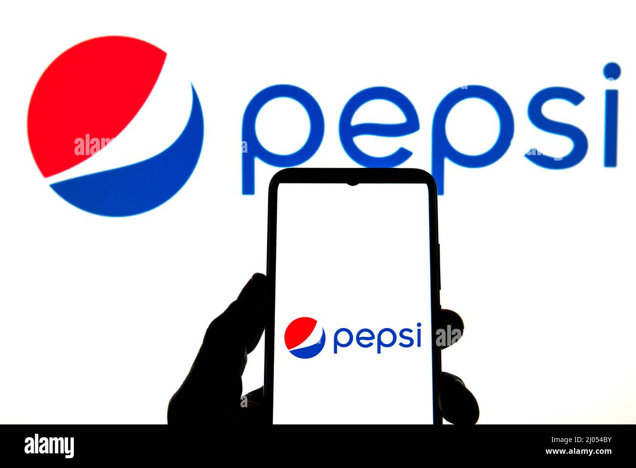 In this photo illustration a Pepsi logo seen displayed on a smartphone ...