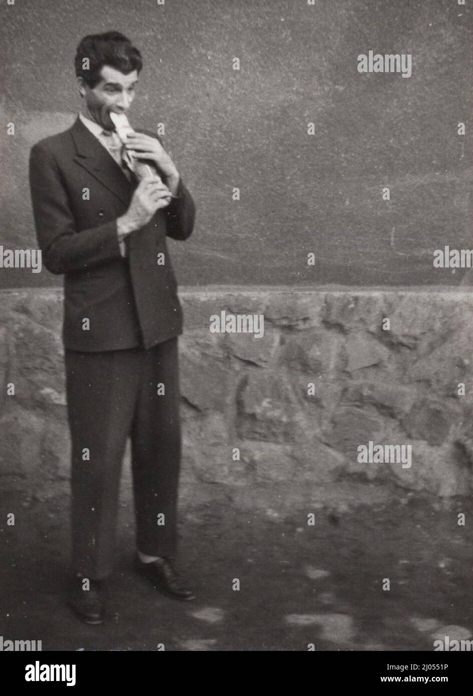 original vintage photo about a card magician who is eating the cards ...