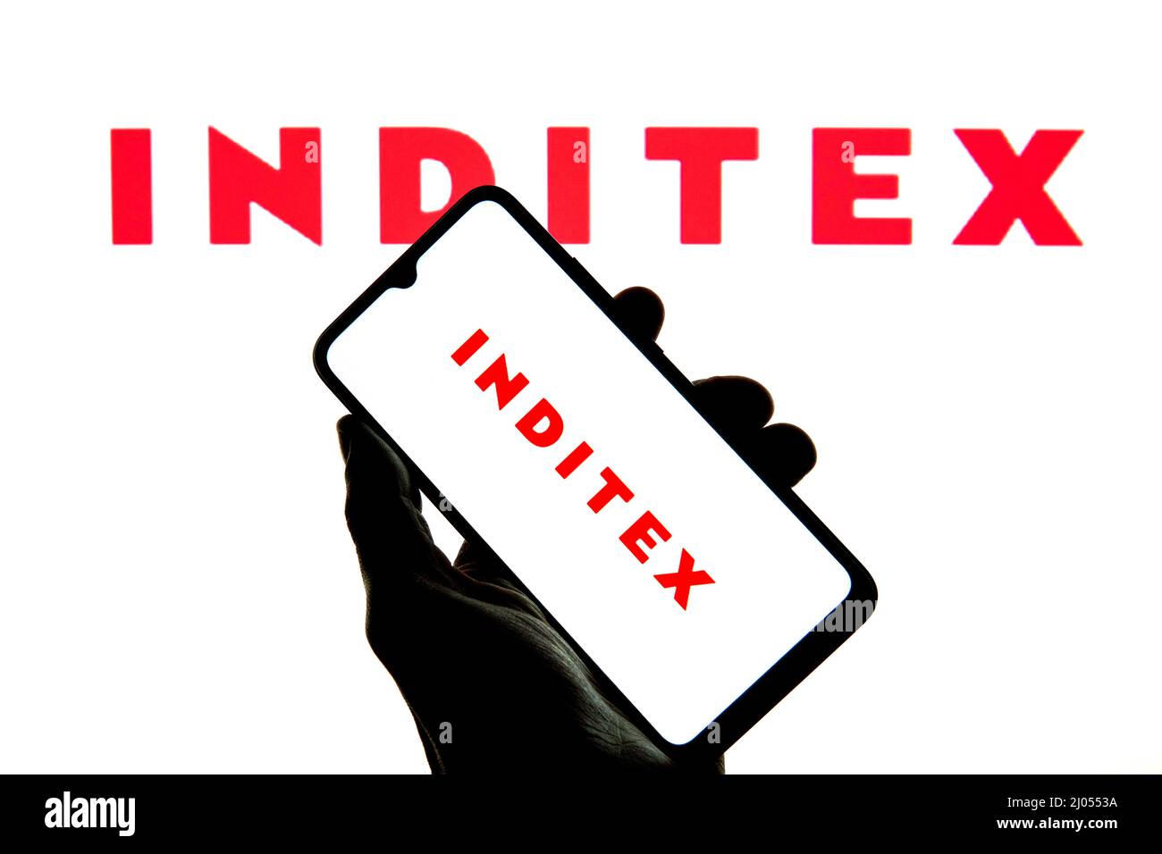 Spain. 11th Mar, 2022. In this photo illustration a Inditex logo seen ...