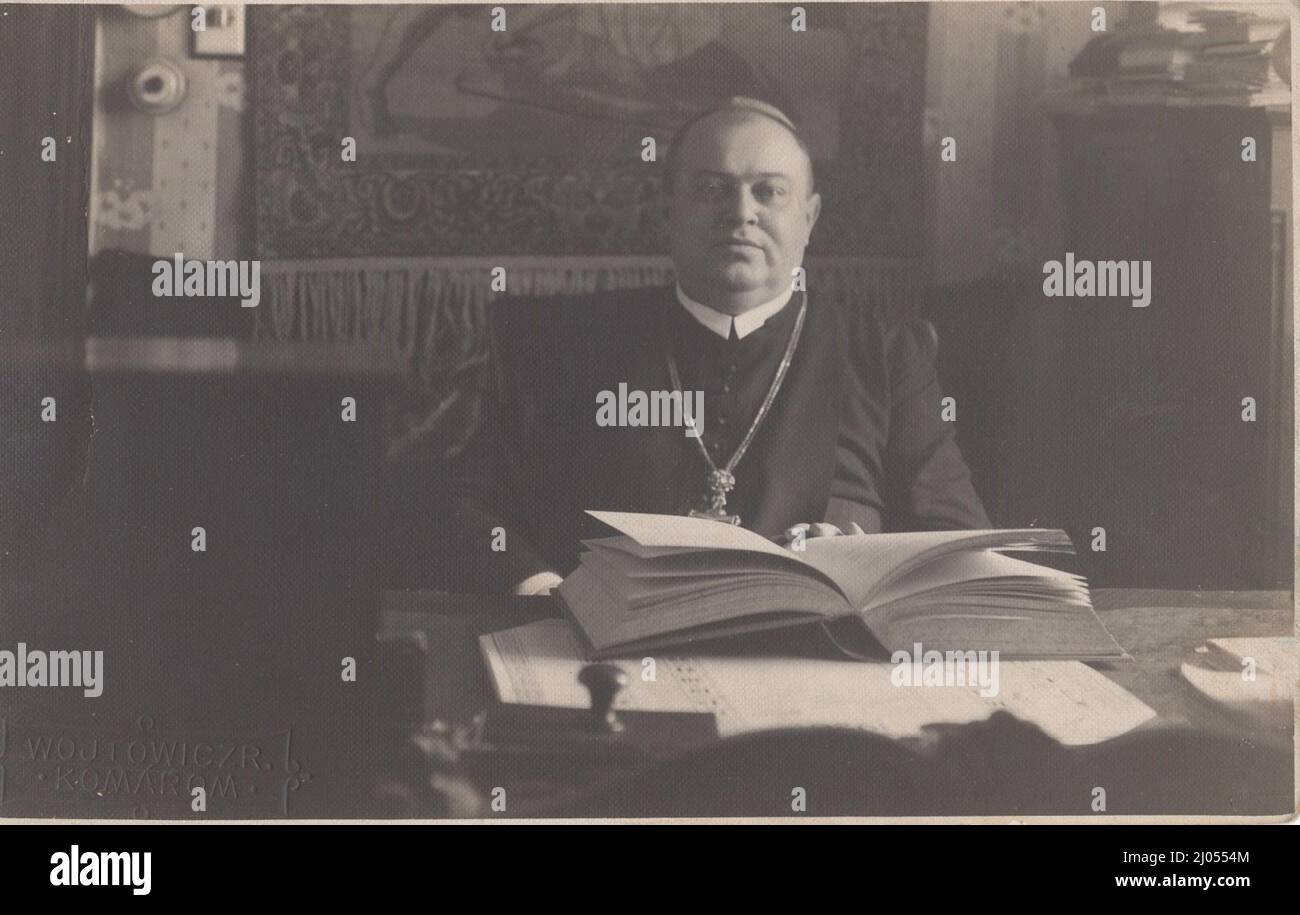 A proud high ranking roman catholic priest is posing for the camera in ...