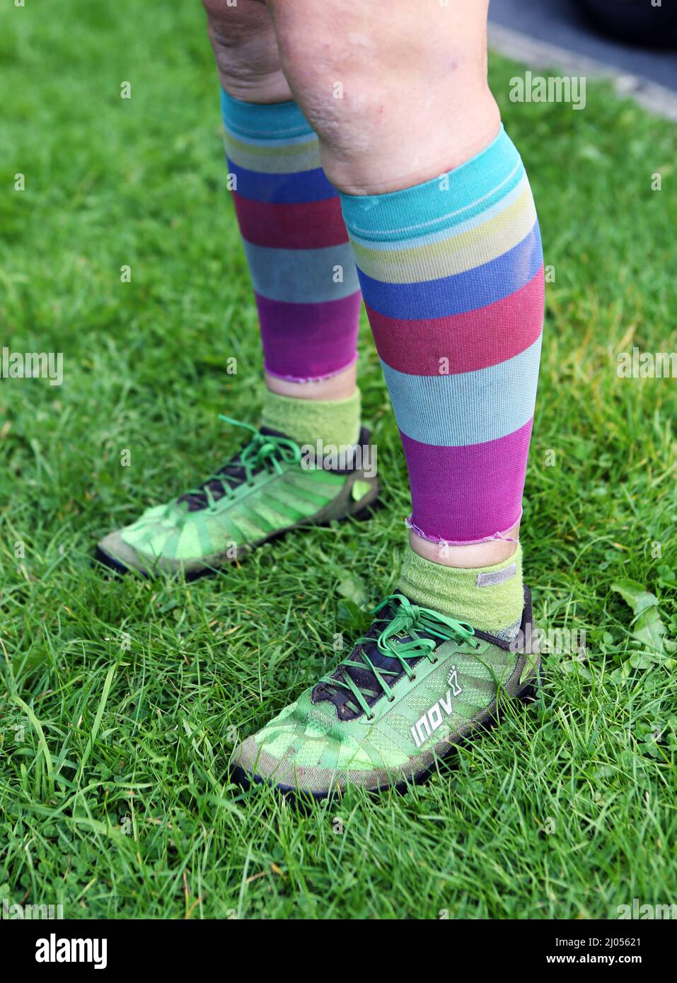 A Colourful socks and running shoes of a Fell runner on Ilkley Moor in ...