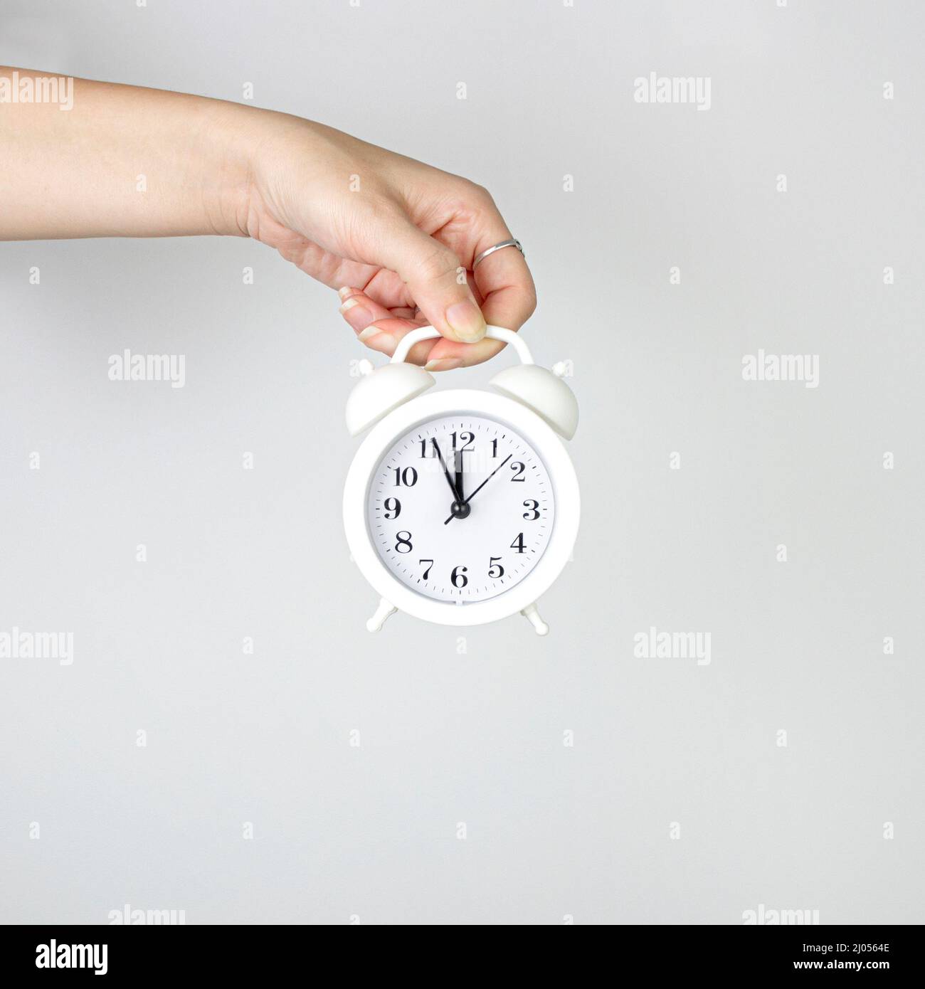 Time management, punctuality, awakening concept. Hand holding alarm ...