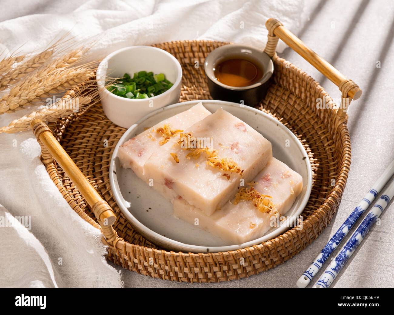 Delicious Chinese traditional turnip cake with spring onion, sauce and ...