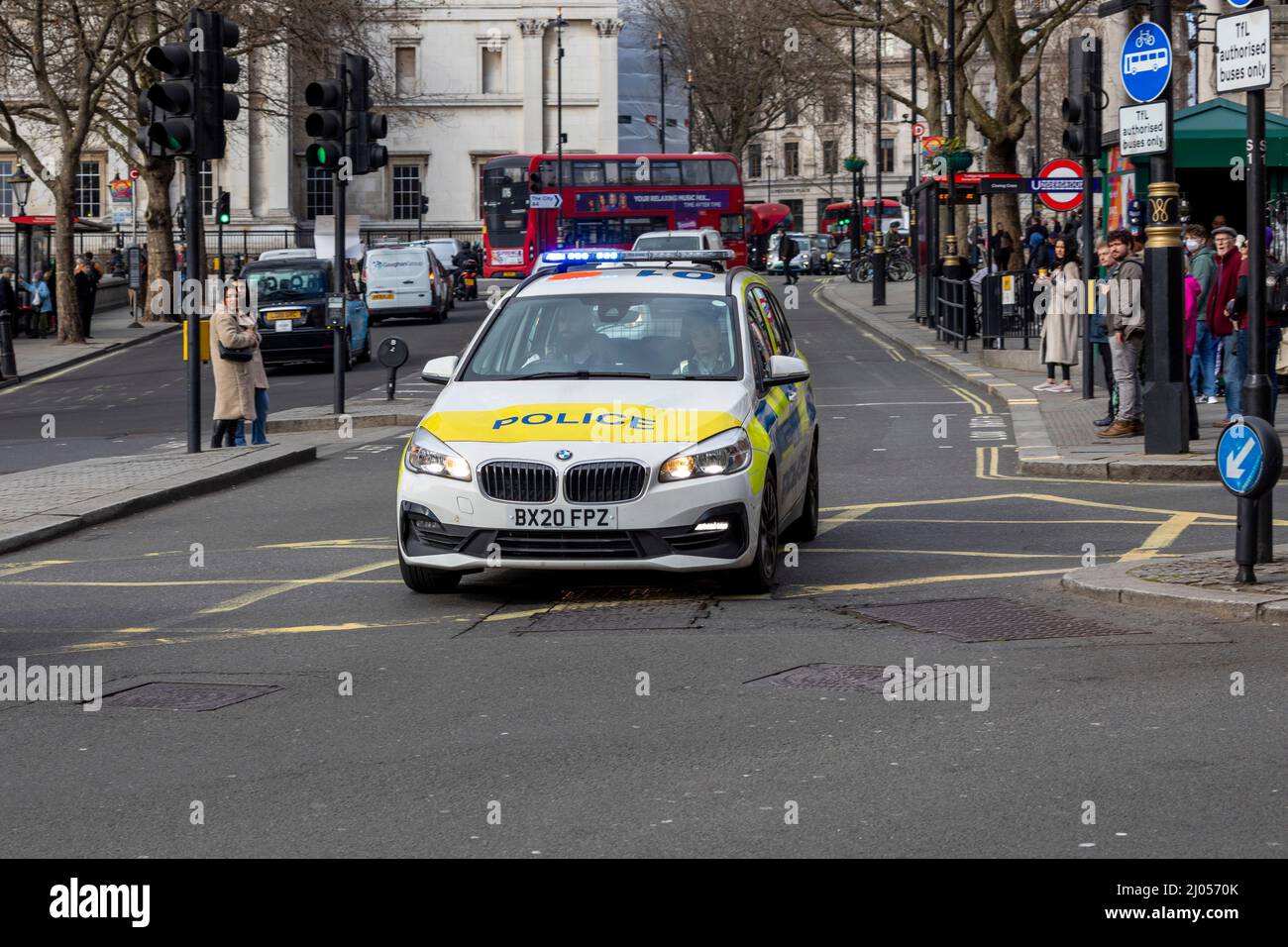 A Metropolitan Police car on blue lights at Trafalgar Square, London ...