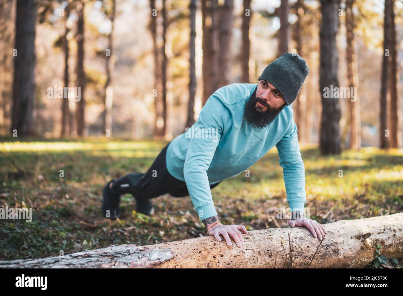 Man exercising push ups in nature Stock Photo - Alamy