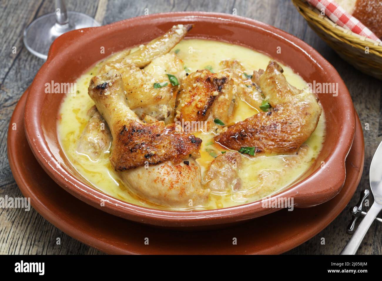 Shkmeruli is a traditional Georgian dish of chicken in garlic milk ...