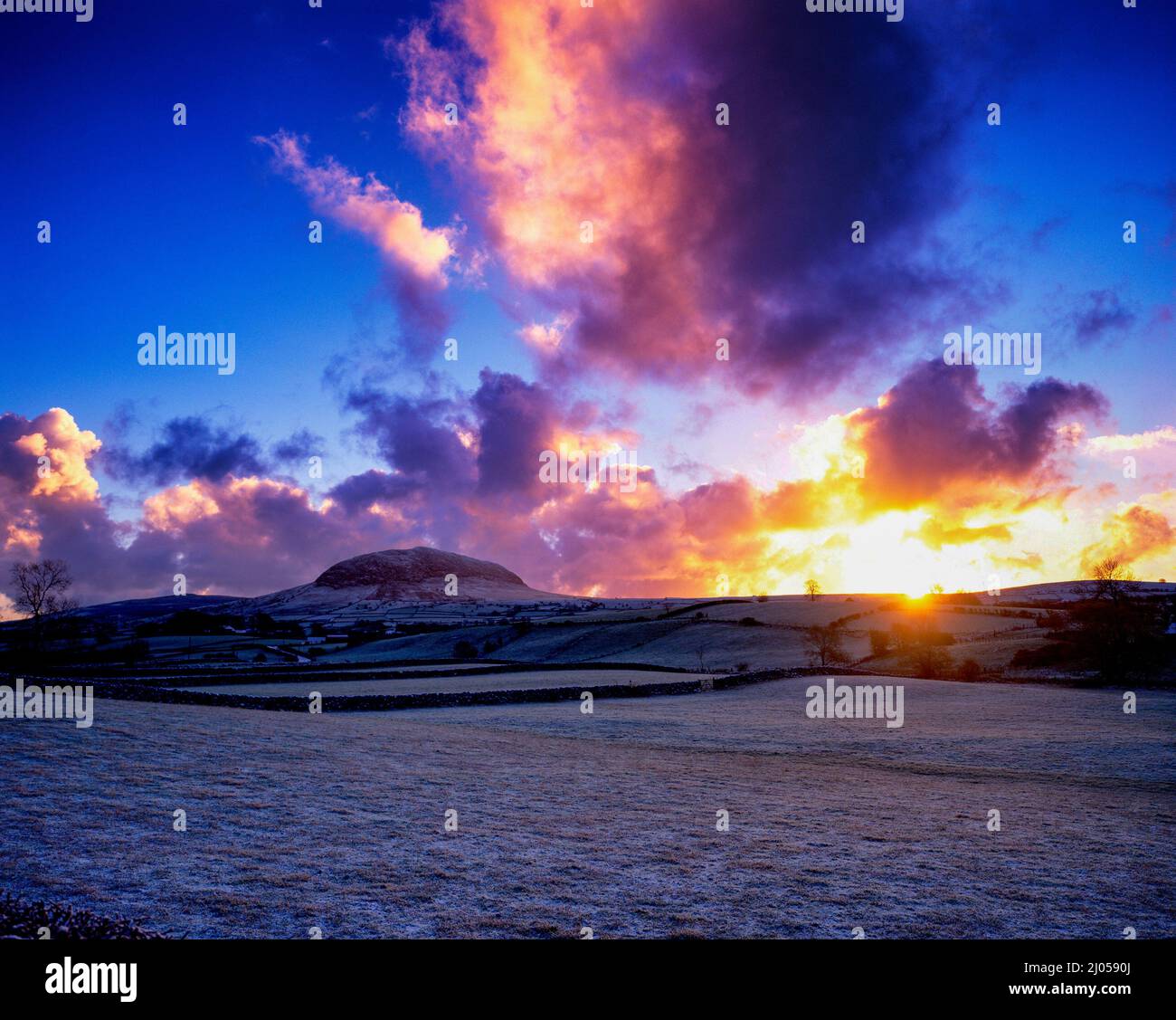 A snow covered Slemish Mountain at Sunset, County Antrim, Northern ...