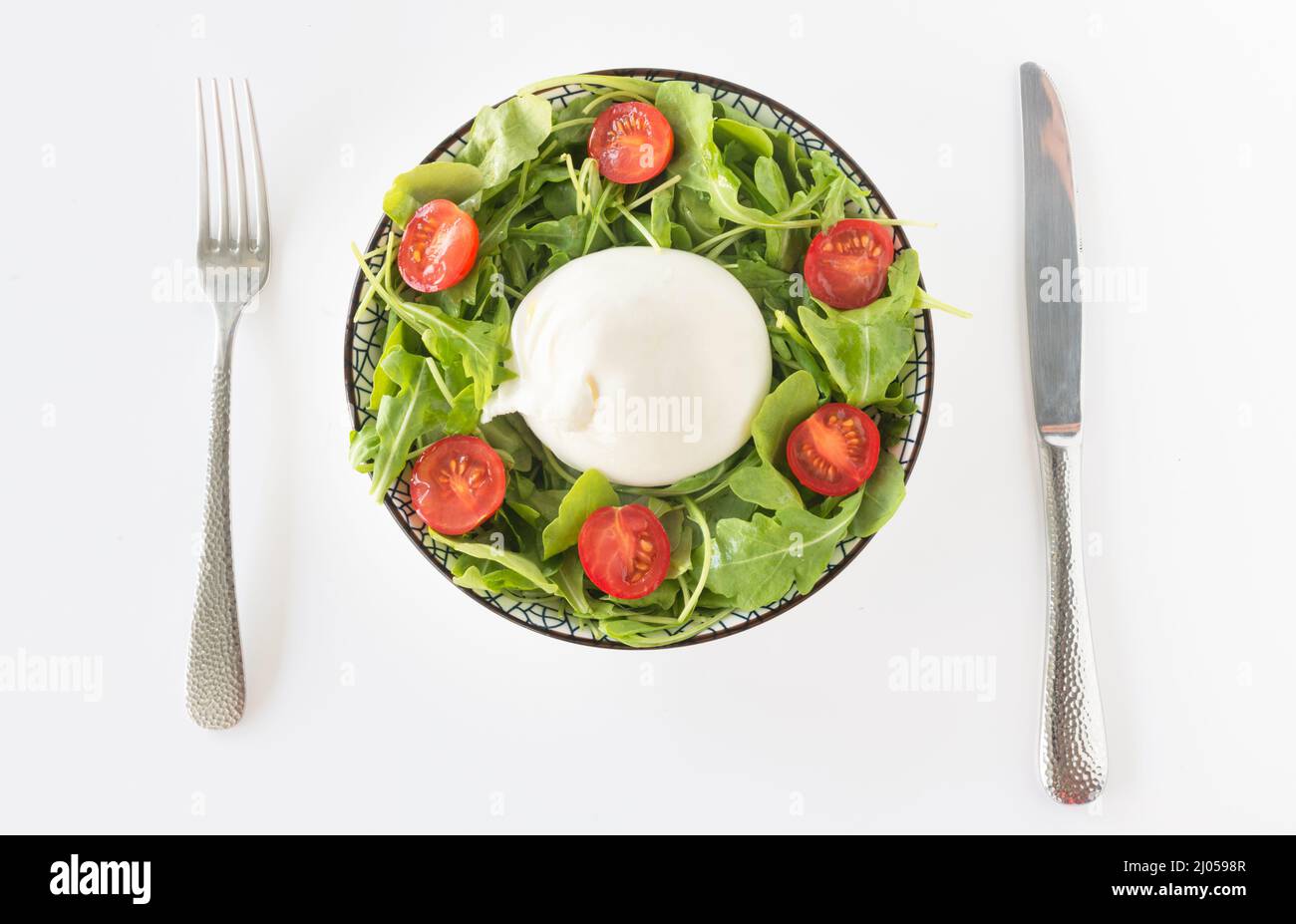 Italian style burrata salad isolated on white Stock Photo - Alamy