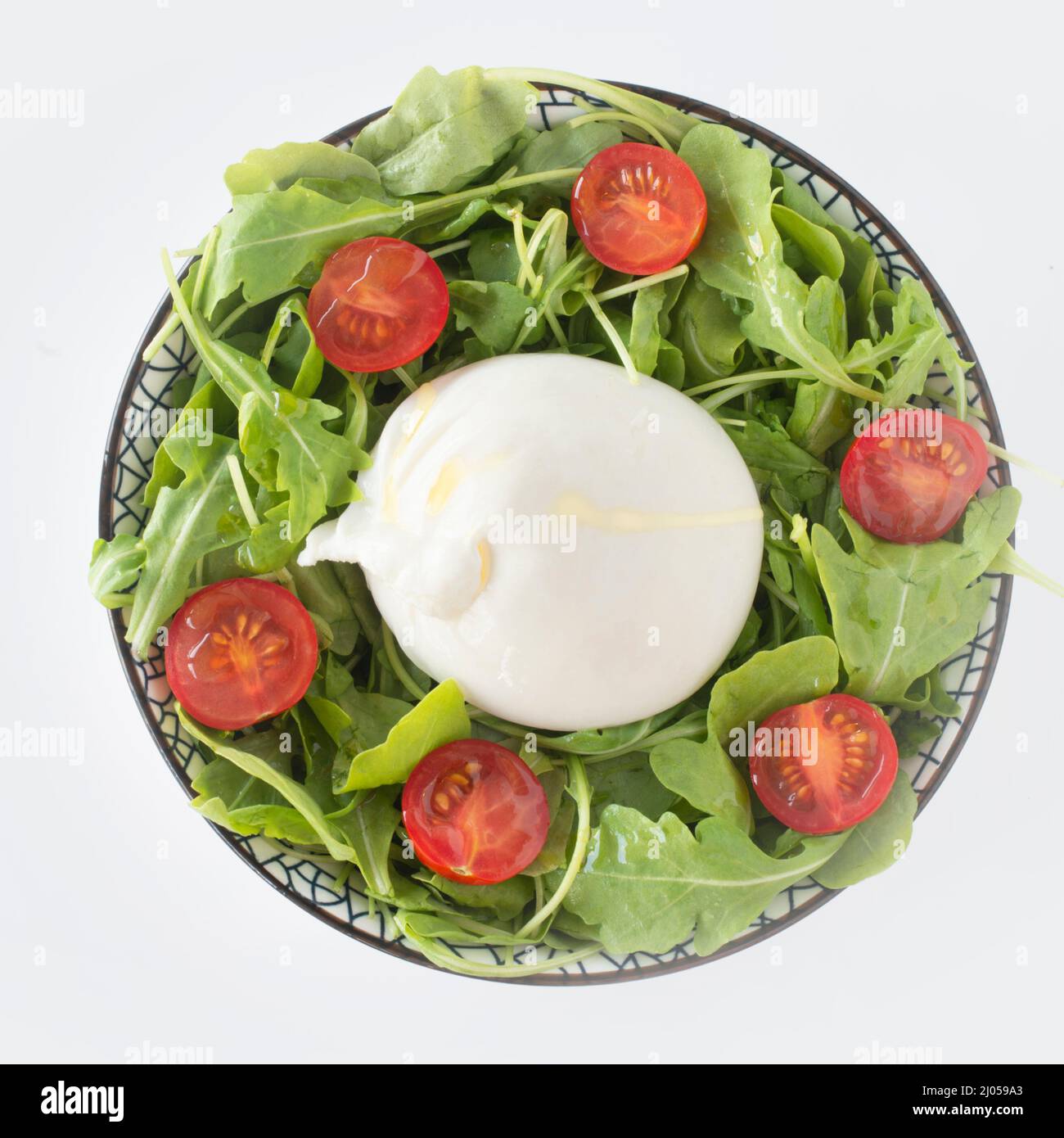 Italian style burrata salad isolated on white Stock Photo - Alamy