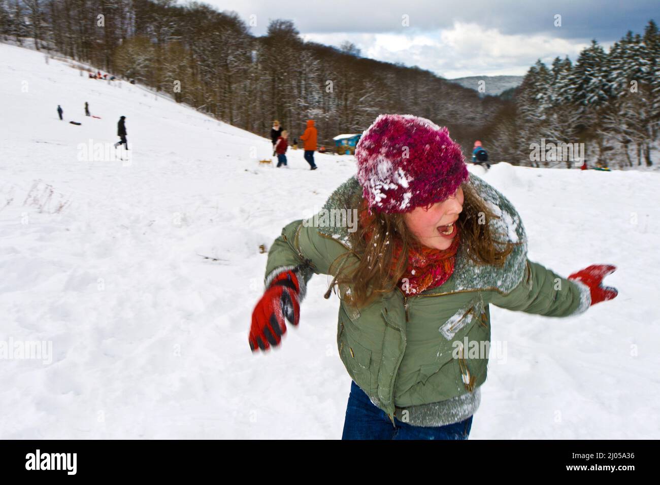 children have a snowball fight in the white beautiful snowy area Stock ...