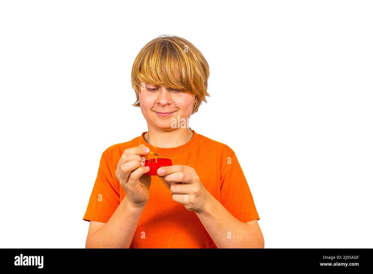 boy likes to play with matches and a candle Stock Photo - Alamy