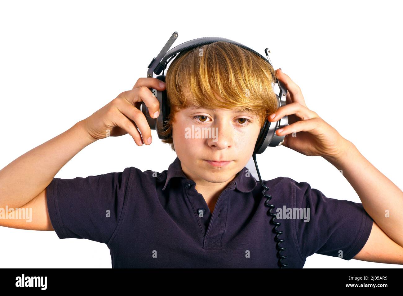 boy enjoys listening to music with headphones Stock Photo - Alamy