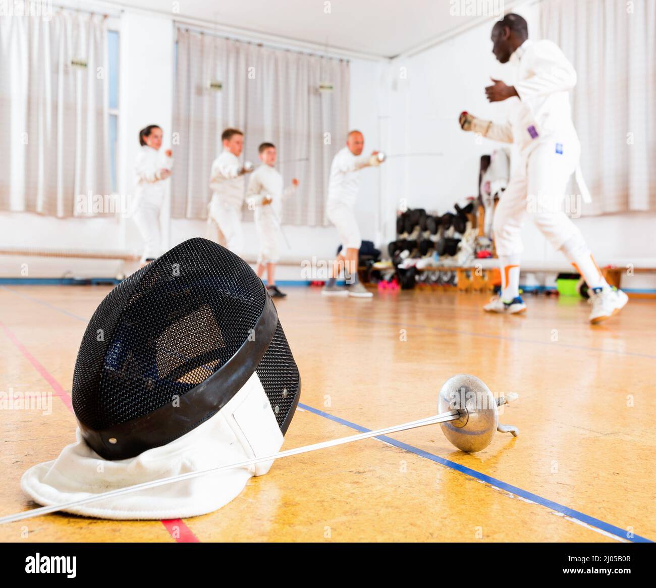 Closeup of fashionable modern beautiful stylish fencing mask and rapier ...