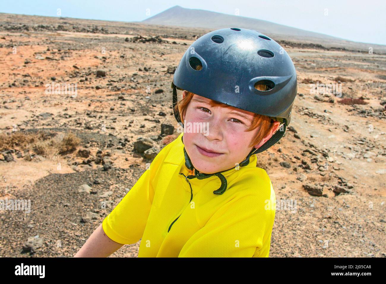 boy riding his mountainbike offroads and doing tricks Stock Photo - Alamy