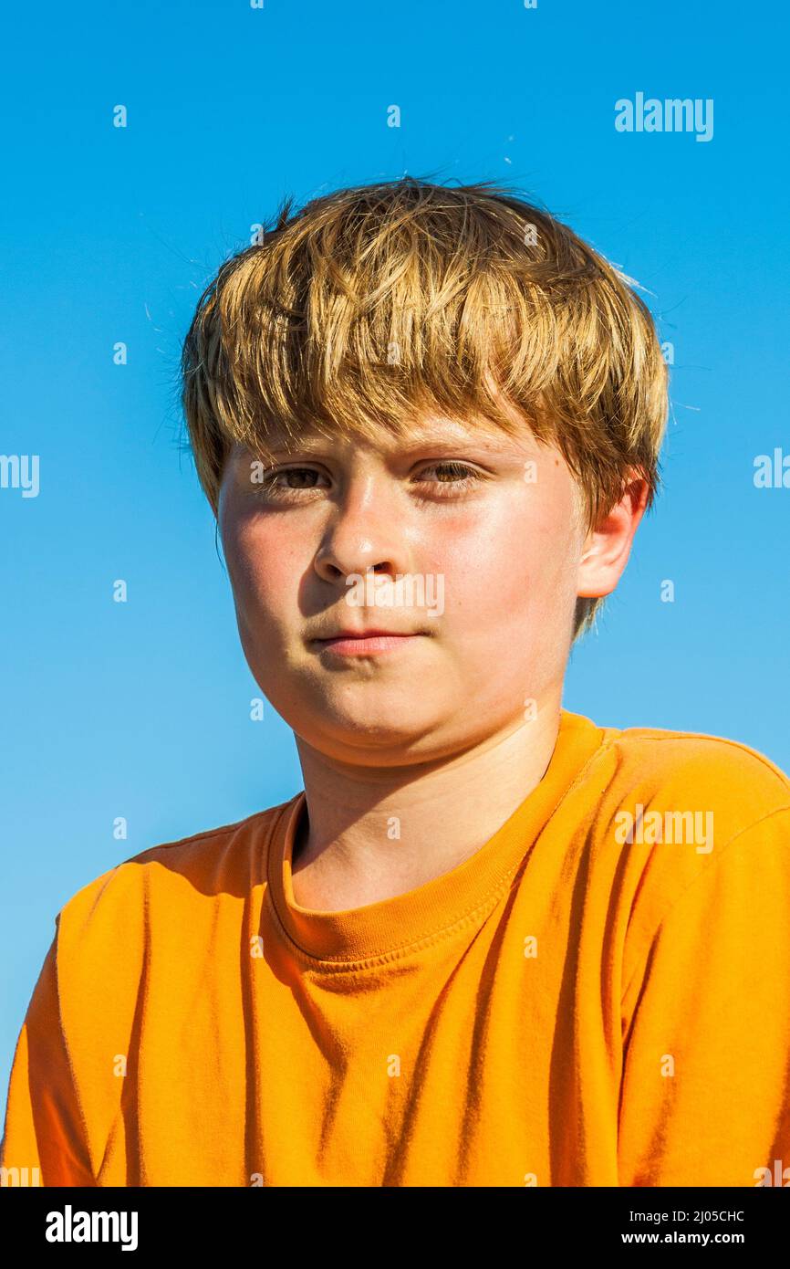 portrait of sweating boy after sports under blue sky Stock Photo - Alamy