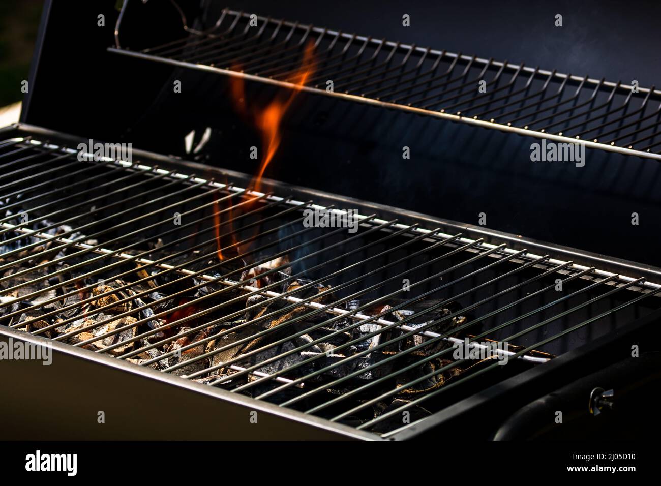 Barbecue Grill Pit With Glowing And Flaming Hot Open Fire With Red